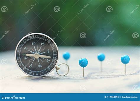 Compass And Pin Point Marking With Vintage Map Background Royalty Free Stock Image