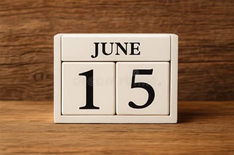 Calendar Block Displaying June 15th On Wooden Surface Indicating A Specific Date Or Important