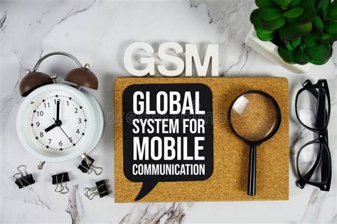 Gsm Global System For Mobile Communication Acronym With Alarm Clock And Magnifying Glass