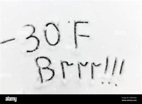Drawn On The Snow Temperature Symbols Denoting Negative Very Cold Weather Which Is Marked In
