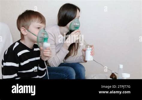 Use Nebulizer And Inhaler For The Treatment Woman And Babe Inhaling Through Inhaler Mask Side