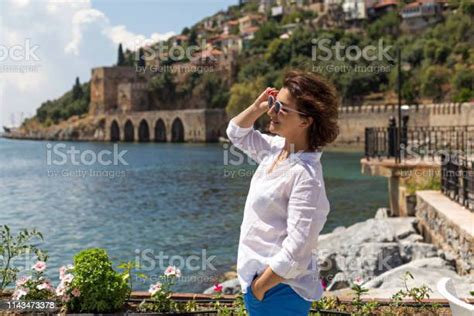 Solo Female Traveller Concept Female Wearing White Shirt In Fro Stock
