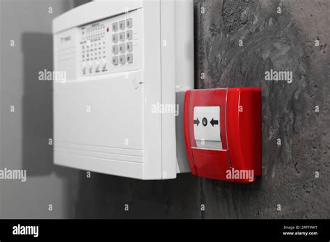 Fire Alarm Push Button And House Security System Control Panel On Grey Wall Stock Photo Alamy