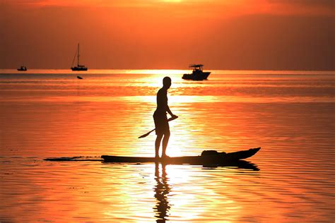 Paddleboarding In The Sunset Pure Vacations