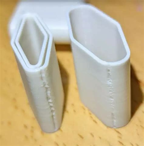 underextrusion seams of print are underextruded causing large pits