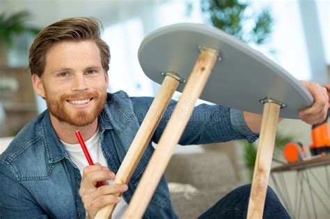 Man Assembles Furniture At Home Stock Photo Image Of Furnishinghouse Engineer 275986212