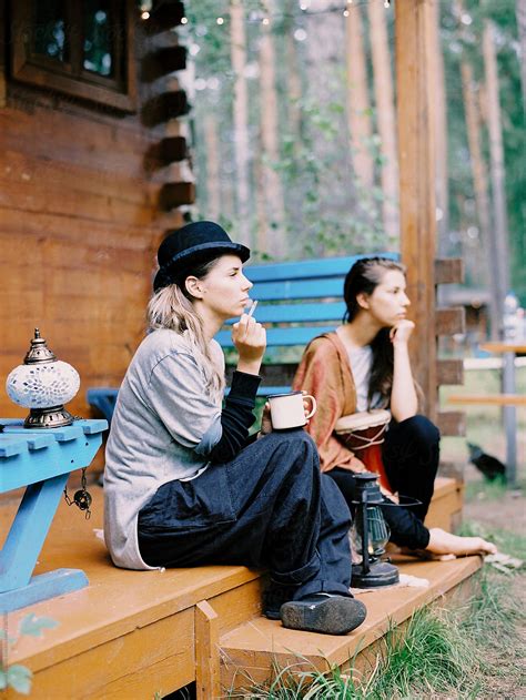 Girl With Friend On Porch Smoking By Stocksy Contributor Alexandr