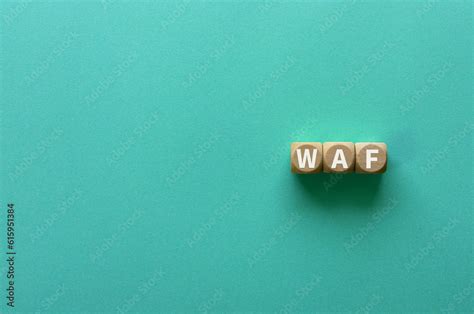 There Is Wood Cube With The Word Waf It Is An Abbreviation For Web Application Firewall As Eye