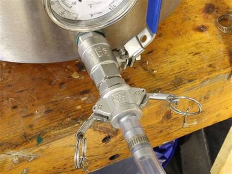 A Stainless Steel Camlock Coupling Connects With An Equipment