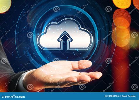 Close Up Of Businessman Hand Holding Glowing Round Cloud Hologram On Blurry Bokeh Background