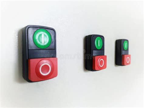 Green And Red Electrical Button Switches In A White Background Stock