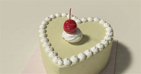 위에 체리가 달린 하트 모양의 케이크 사진 Unsplash의 케이크 이미지