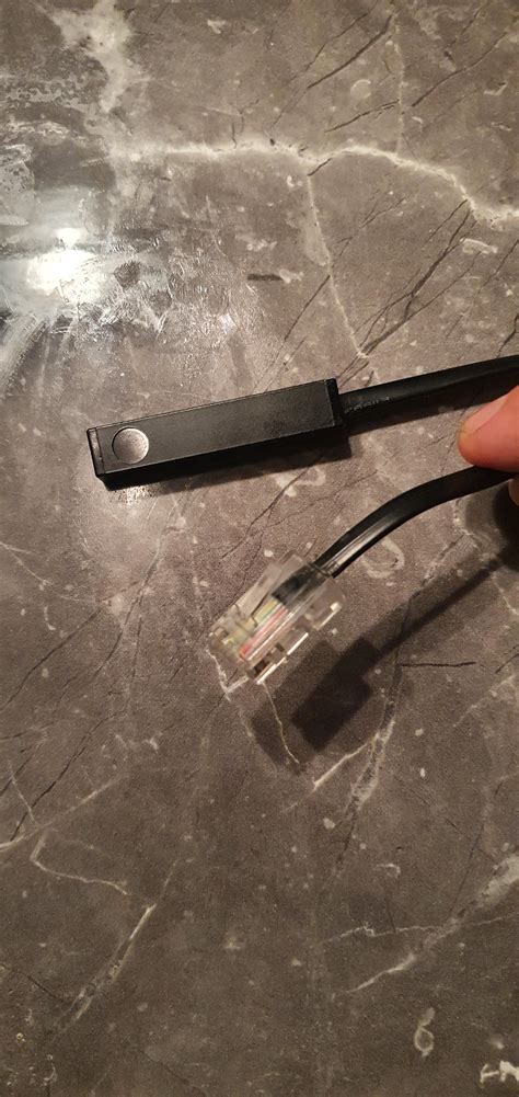Ethernet Cable With Sensor Thing On One End Whatisthis