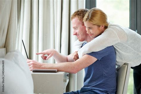 Beautiful Babe Woman Hugging Babefriend From Behind When He Is Showing His Project On Laptop