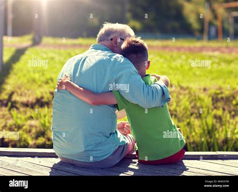 Grandfather And Grandson Hugging On Berth Stock Photo Alamy