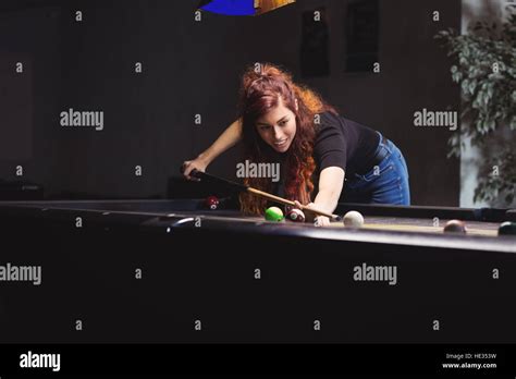 Beautiful Woman Playing Pool Playing Pool In The Billiards Club Stock