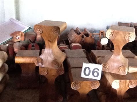 Several Wooden Chairs With Numbers On Them And One Has A Sign That Says 60
