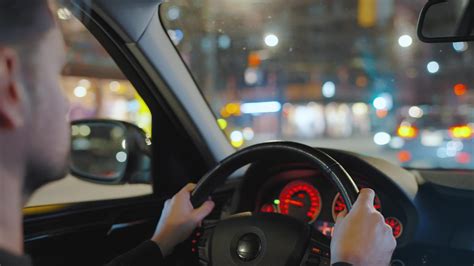 Man Driving Car Through The Streets Of Night City 25280573 Stock Video