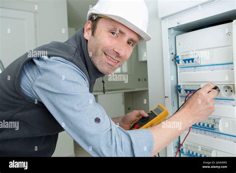 Electrician Testing Circuit Breaker With Multimeter Stock Photo Alamy