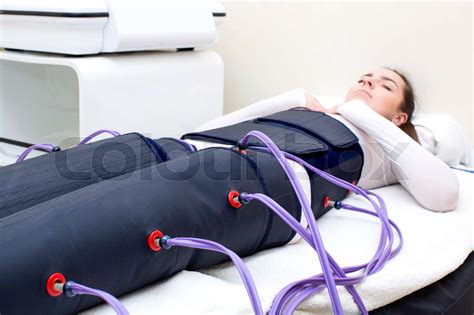Woman At The Clinic For The Treatment Of Pressure Therapy Procedure Stock Image Colourbox
