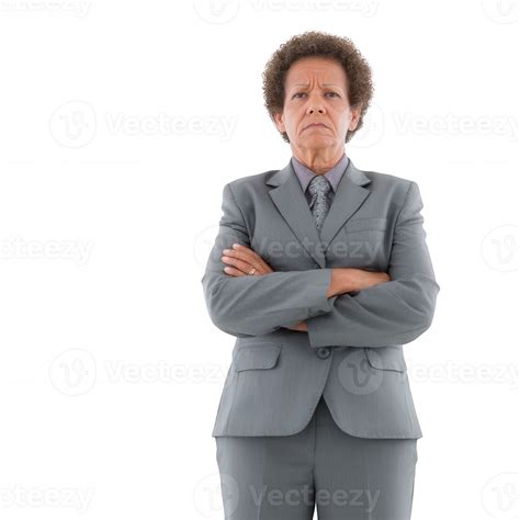 Confident Professional Woman In A Gray Suit Standing With Arms Crossed Expressing Authority And