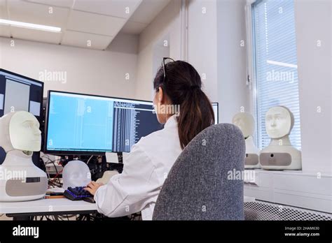 Female Engineer Sitting At Work Station Stock Photo Alamy