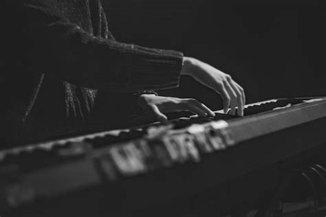 Premium Photo Midsection Of Woman Playing Keyboard