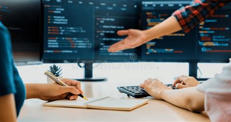 Female Programer Taking A Note While Web Developer Present Program