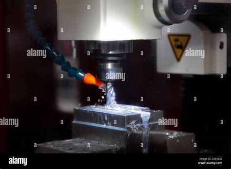 Closeup Of Metal Milling Process Using CNC Machine And Cutting Fluid Selective Focus Stock