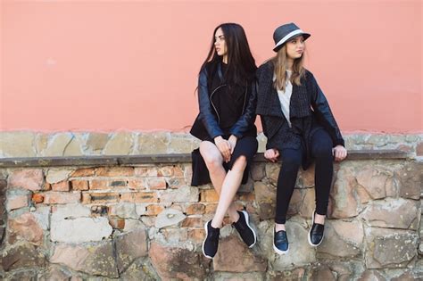 Premium Photo Trendy Models Posing On Wall