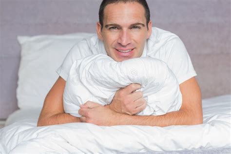 Happy Man Hugging His Pillow Stock Photo Image Of Peaceful Comforter 32516122