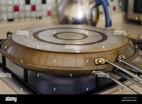 Fish Are Cooking In A Closed Fish Pan Double Sided Fish Pan On The