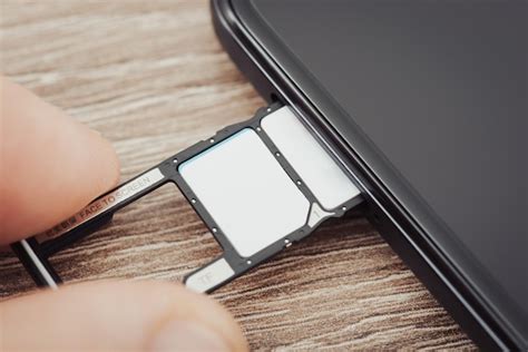 Premium Photo Toned Photo Of Men Inserting Sim Cards To The Phone