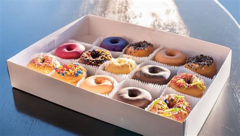 A Box Filled With Lots Of Colorful Dounts On The Table By Arthur Pan Pexels In Rich Color Stock