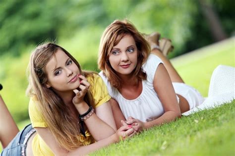 Premium Photo Two Beautiful Girls Hanging In The Park