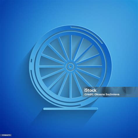 파란색 배경에 격리 된 종이 절단 자전거 휠 아이콘입니다 자전거 경주 익스트림 스포츠 스포츠 장비 종이 아트 스타일입니다 벡터