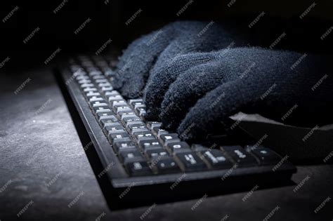 premium photo hacker hand typing on a computer keyboard cyber