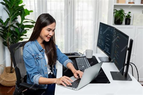 Premium Photo Smiling Asian It Typing Online Software Development On Laptop Stratagem
