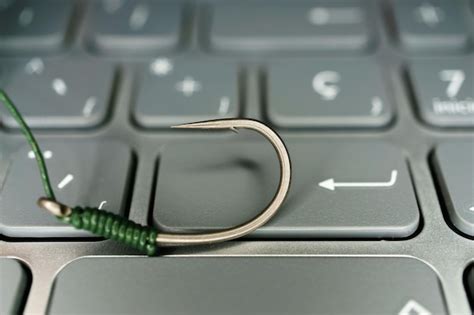 premium photo hook on the keyboard of a computer phising concept