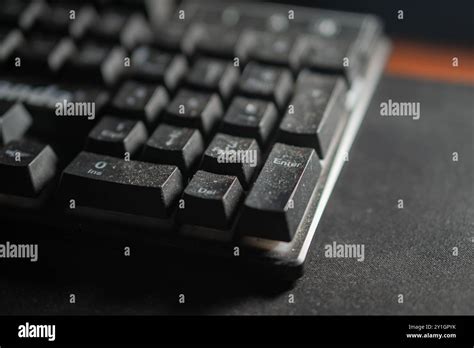 Close Up View Of A Black Computer Keyboard With Various Function Keys And Alphanumeric Keys The