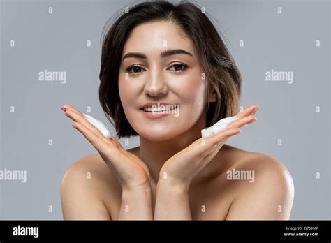 Beautiful Brunette Woman With A Smooth Skin Applying Cleansing Foam On Her Face Stock Photo Alamy