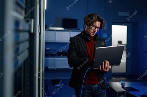 premium photo data engineer holding laptop while working with