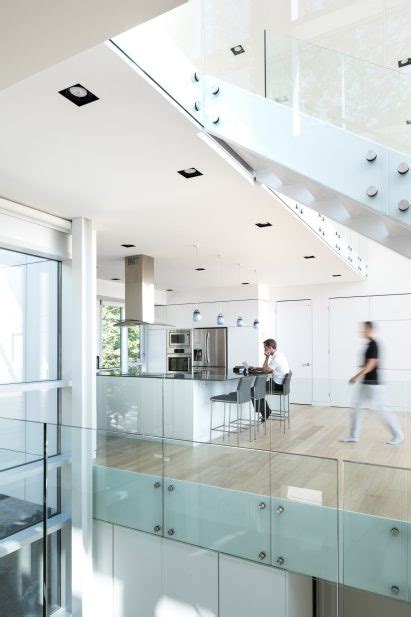 Glazed Atrium Connects White Sides Of Halifax Home By Omar Gandhi