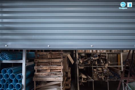 งานติดตั้งประตูม้วนมอเตอร์ไฟฟ้า ร้านขายวัสดุก่อสร้าง Wongguru