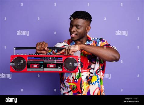 Photo Of Nice Young Man Press Play Button Boombox Isolated On Violet