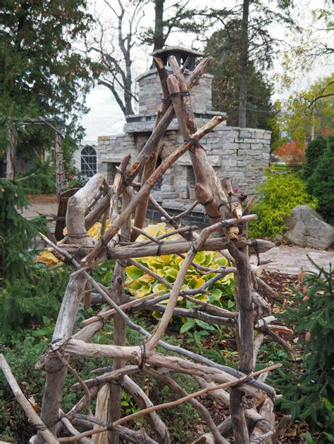 How To Build Garden Obelisk Trellis With Branches And Twigs Diy Hometalk