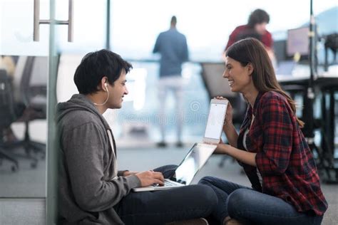 Software Developers Couple Working On The Floor Stock Image Image Of