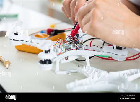 Man Testing Electric Current Of Drone Using Multimeter Tool Stock Photo Alamy