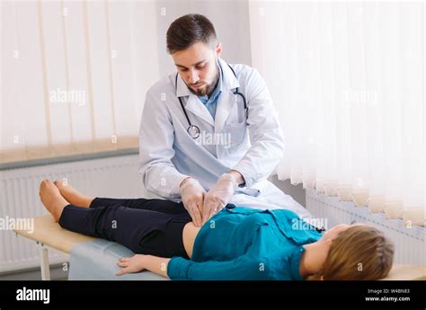 Female Doctor Examines Male Patient Hi Res Stock Photography And Images Alamy