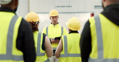 Construction Worker Simulating Workplace Fall For Safety Training